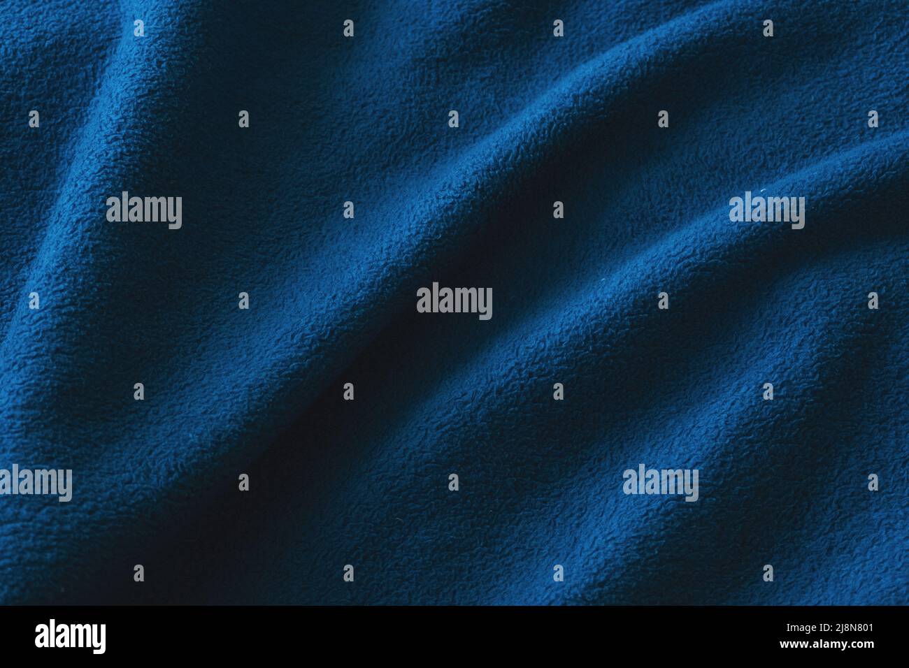 Blue colored fleece blanket background texture Stock Photo - Alamy