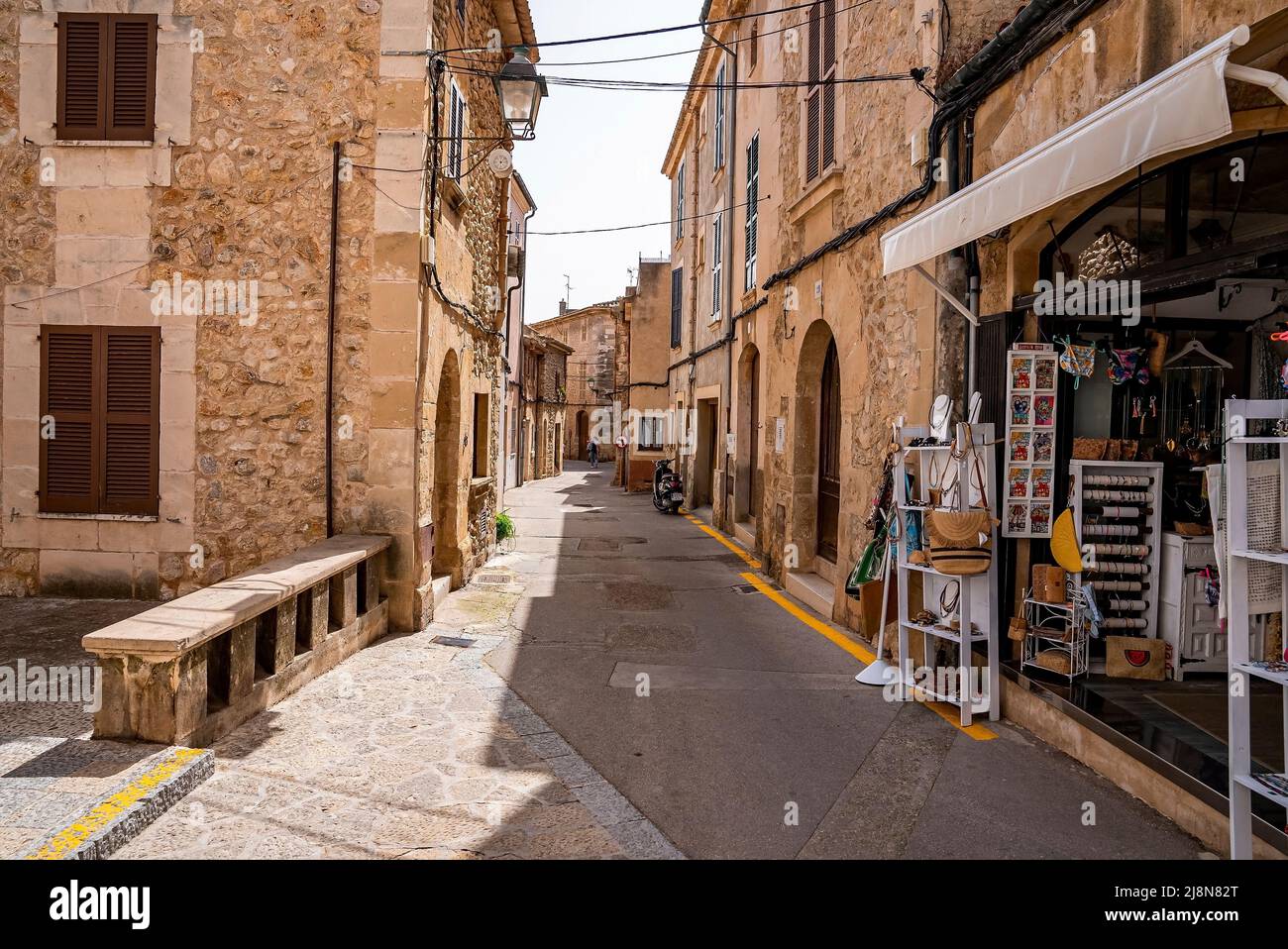 Shops in alley by residential buildings against clear sky at city Stock ...