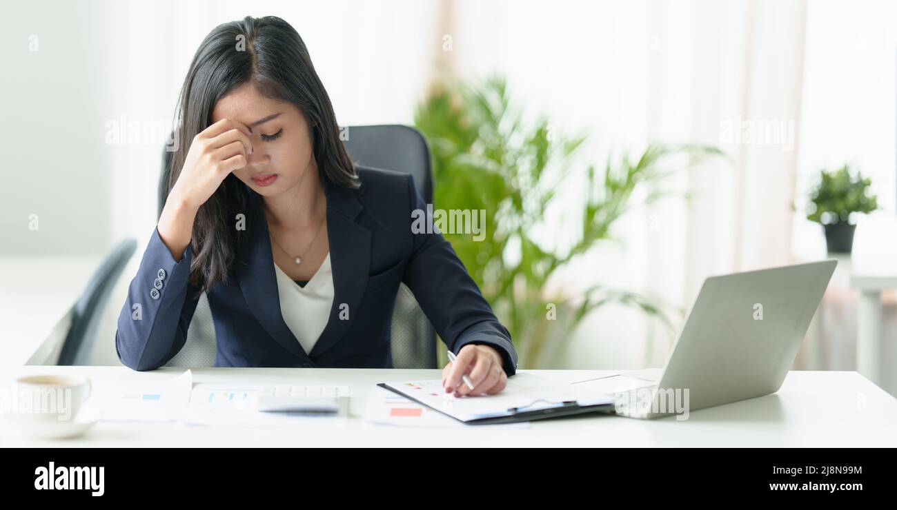 Asian business woman worry about marketing plan of this years Stock ...