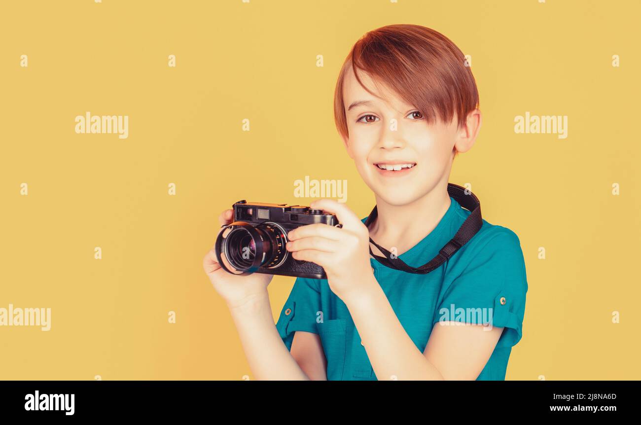 Baby boy with camera. Cheerful smiling child holding a cameras. Little ...