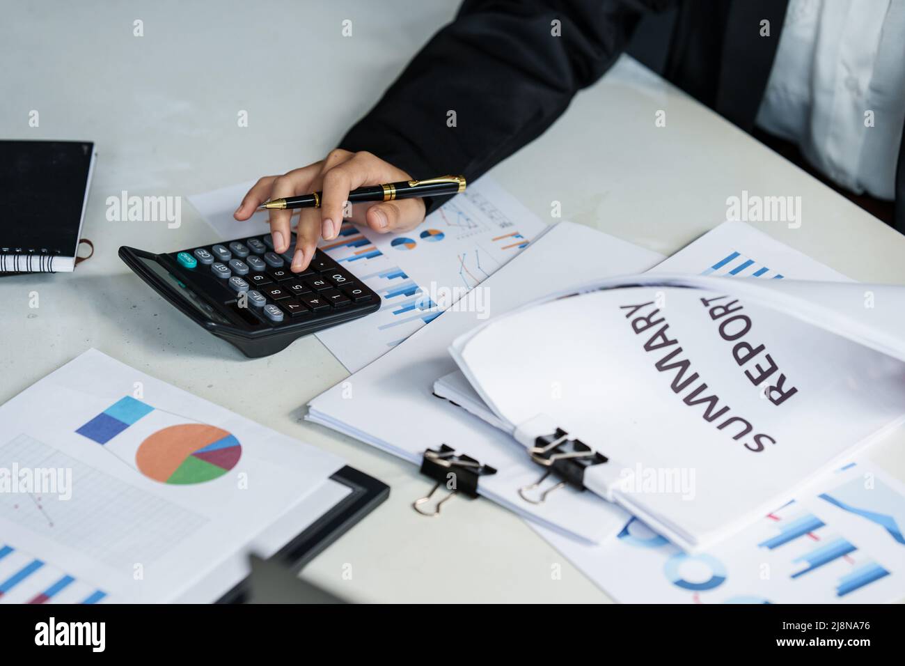 Close up Business woman hand using calculator to calculate the company ...
