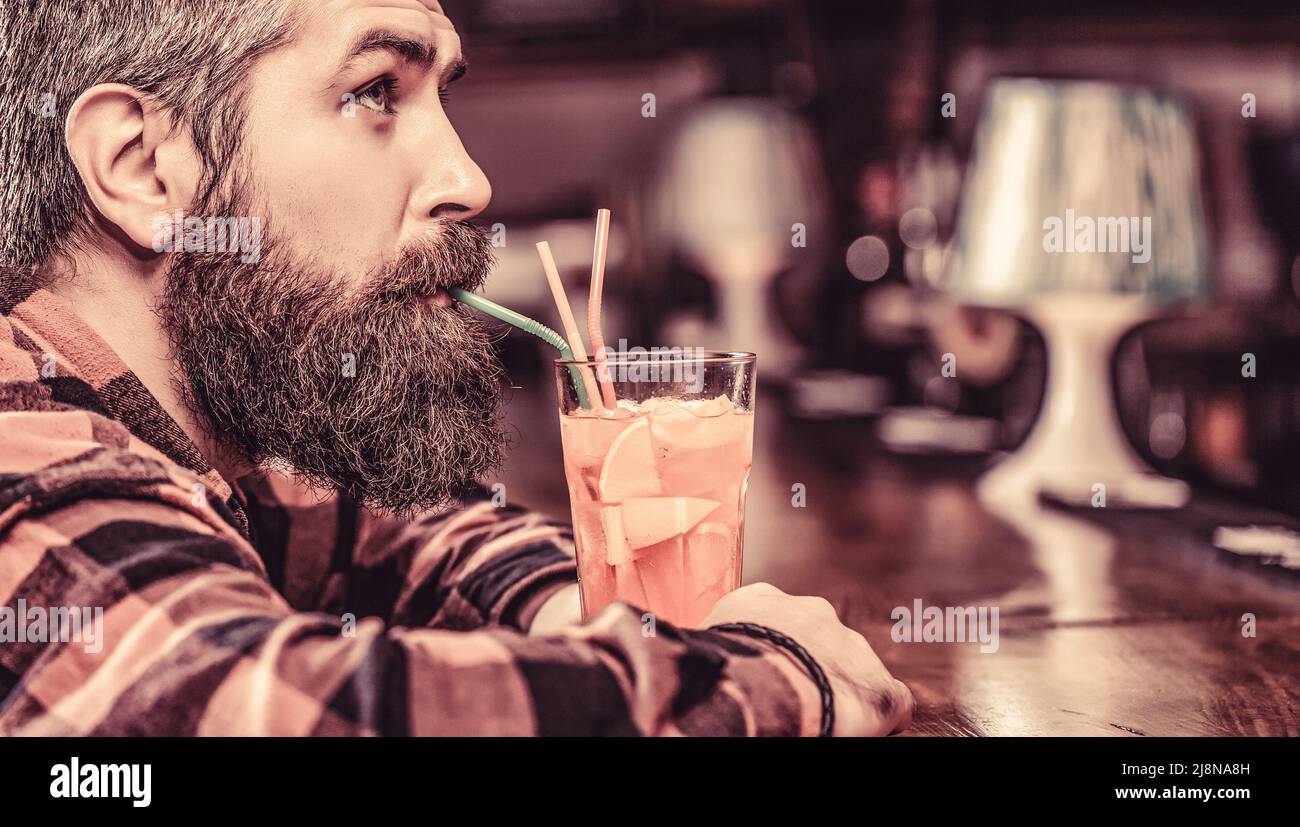 Tropical alcoholic fresh cocktail. Barman in pub or restaurant. Bearded ...