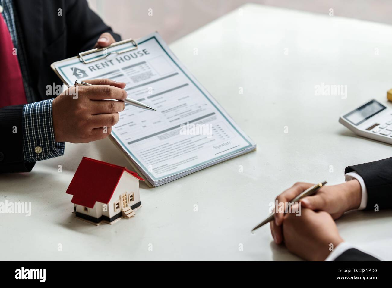 Real Estate Agent explain insurance and agreement contract to client ...