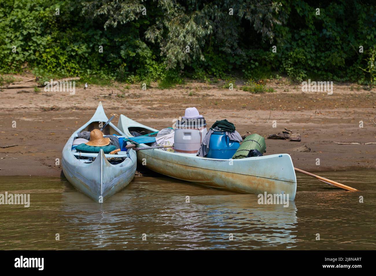 Canoes on the Riverside Stock Photo - Alamy