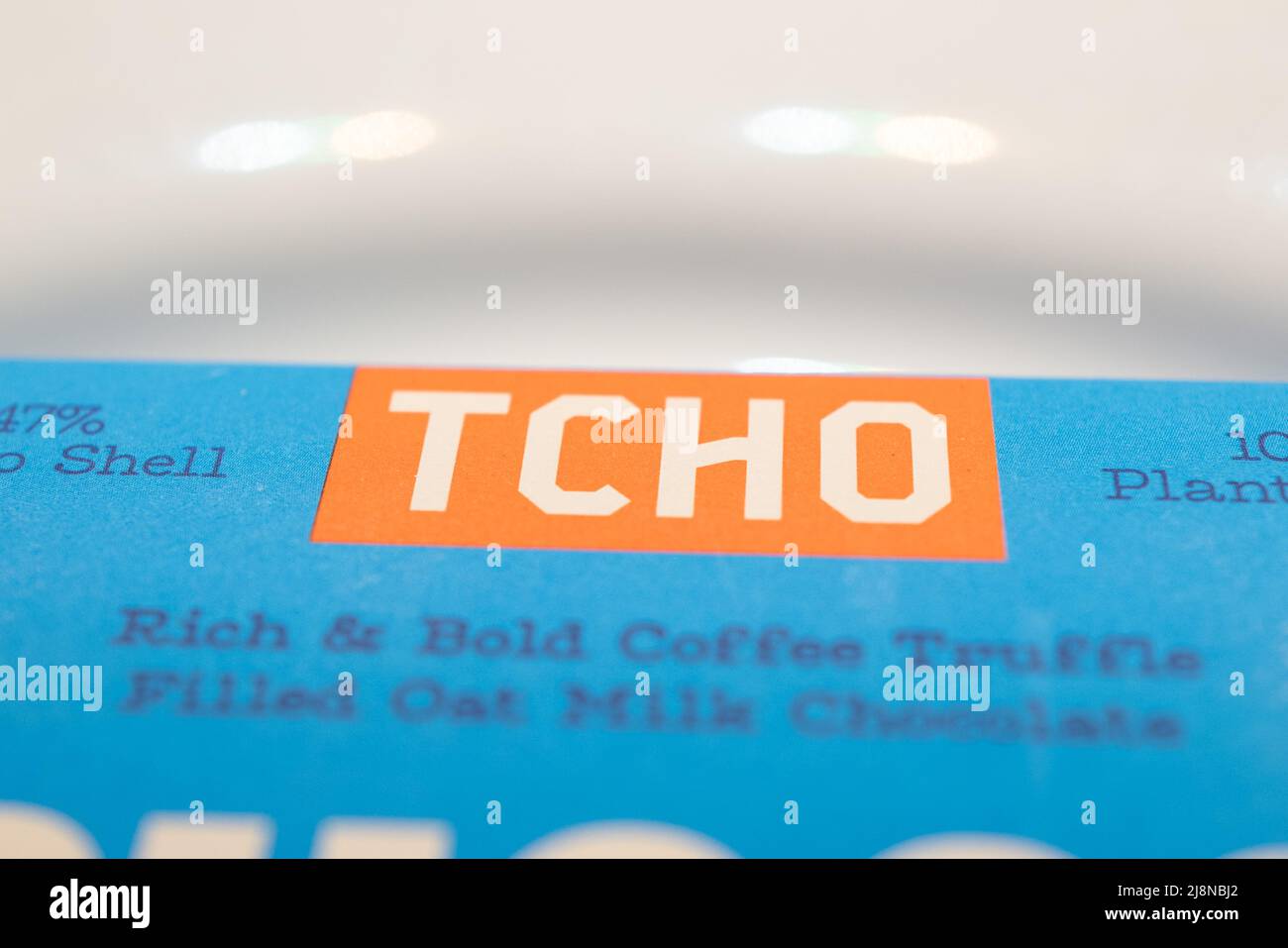 Close-up of logo for TCHO chocolate on chocolate bar against white ...