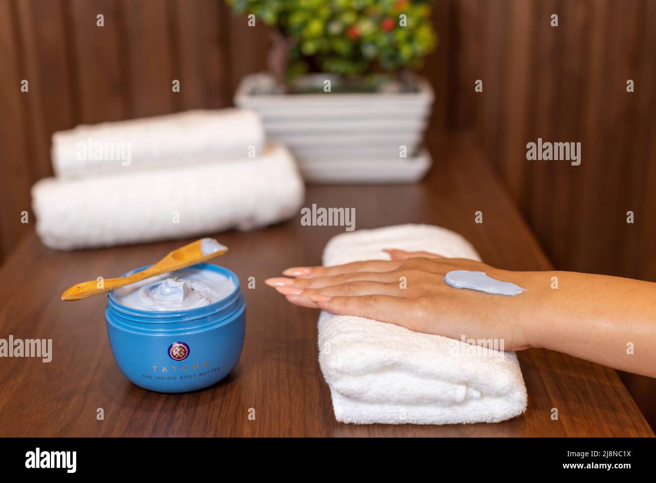 Putting Tatcha cream for hands Stock Photo - Alamy