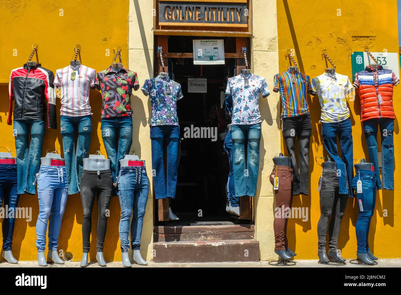 Storefront with display of clothes for sale, Historic center of San ...