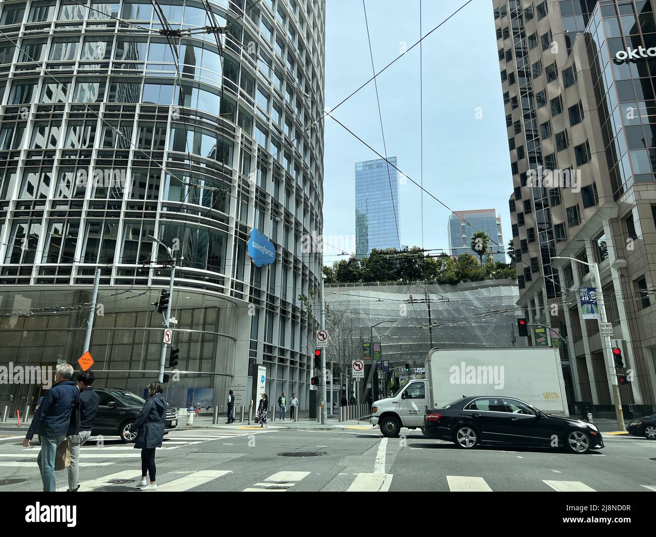 Pedestrians and vehicles are visible at the base of the Salesforce ...