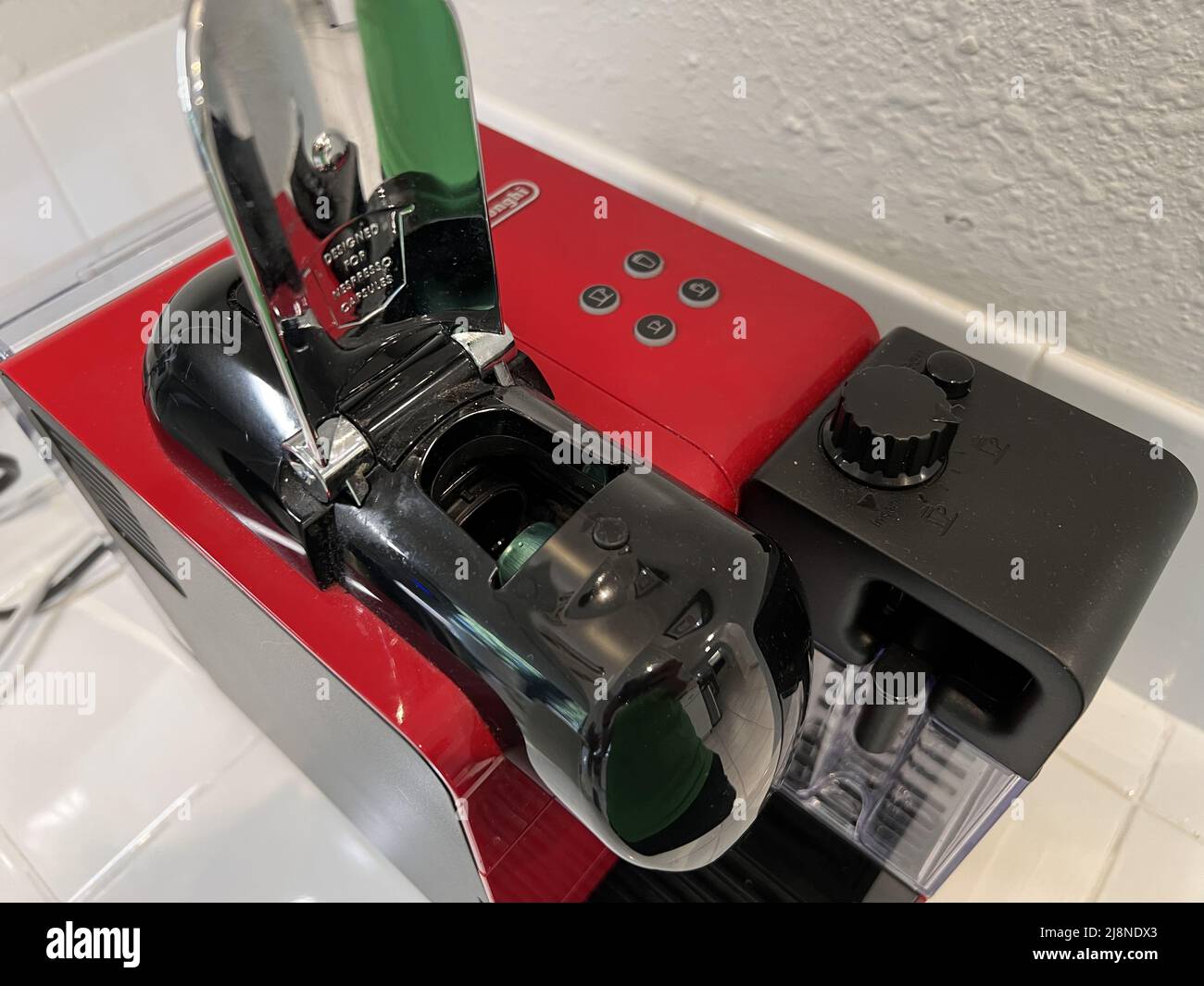 Red-colored Nespresso single-serving espresso maker from DeLonghi on ...