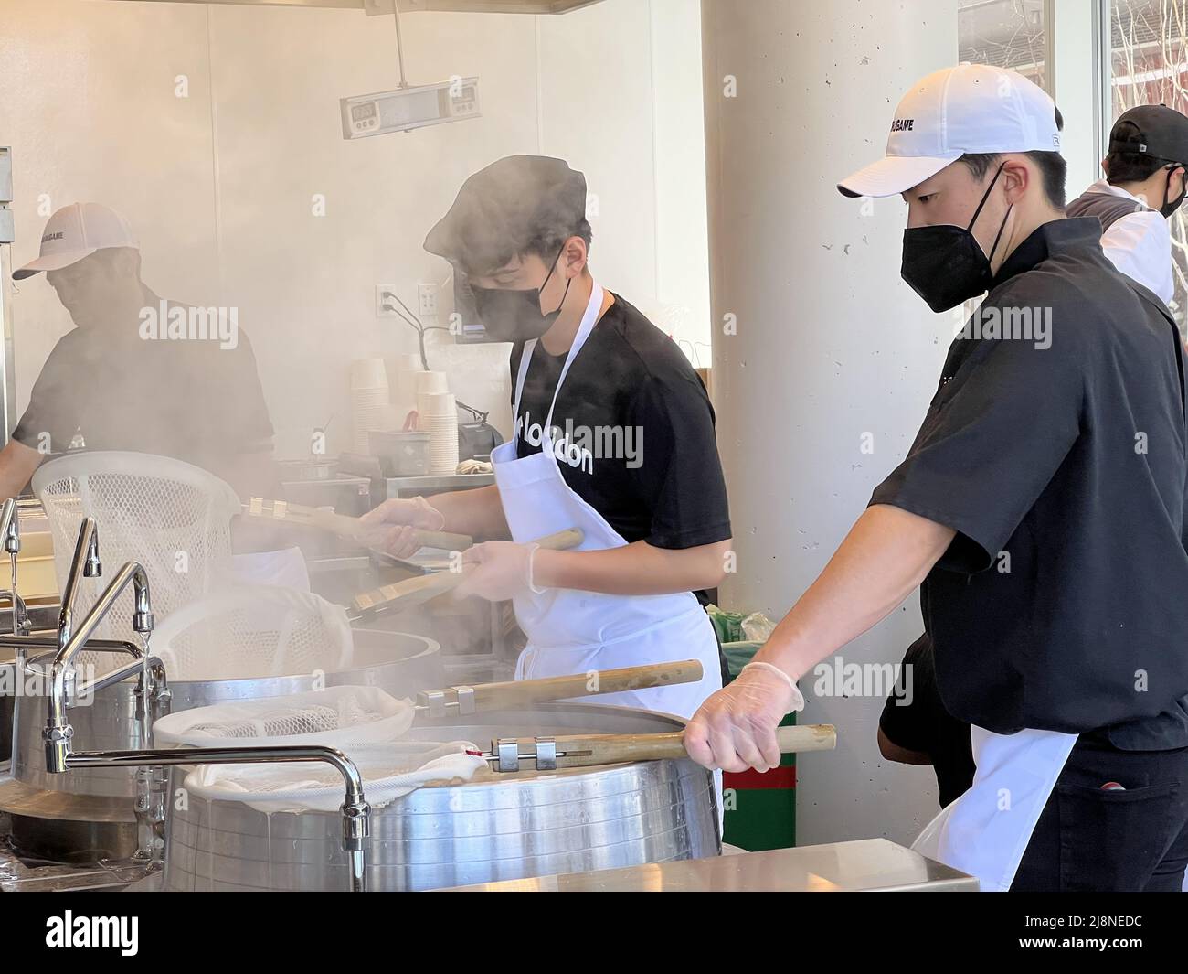 USA. 09th Mar, 2022. Chefs prepare udon noodles during grand opening of ...