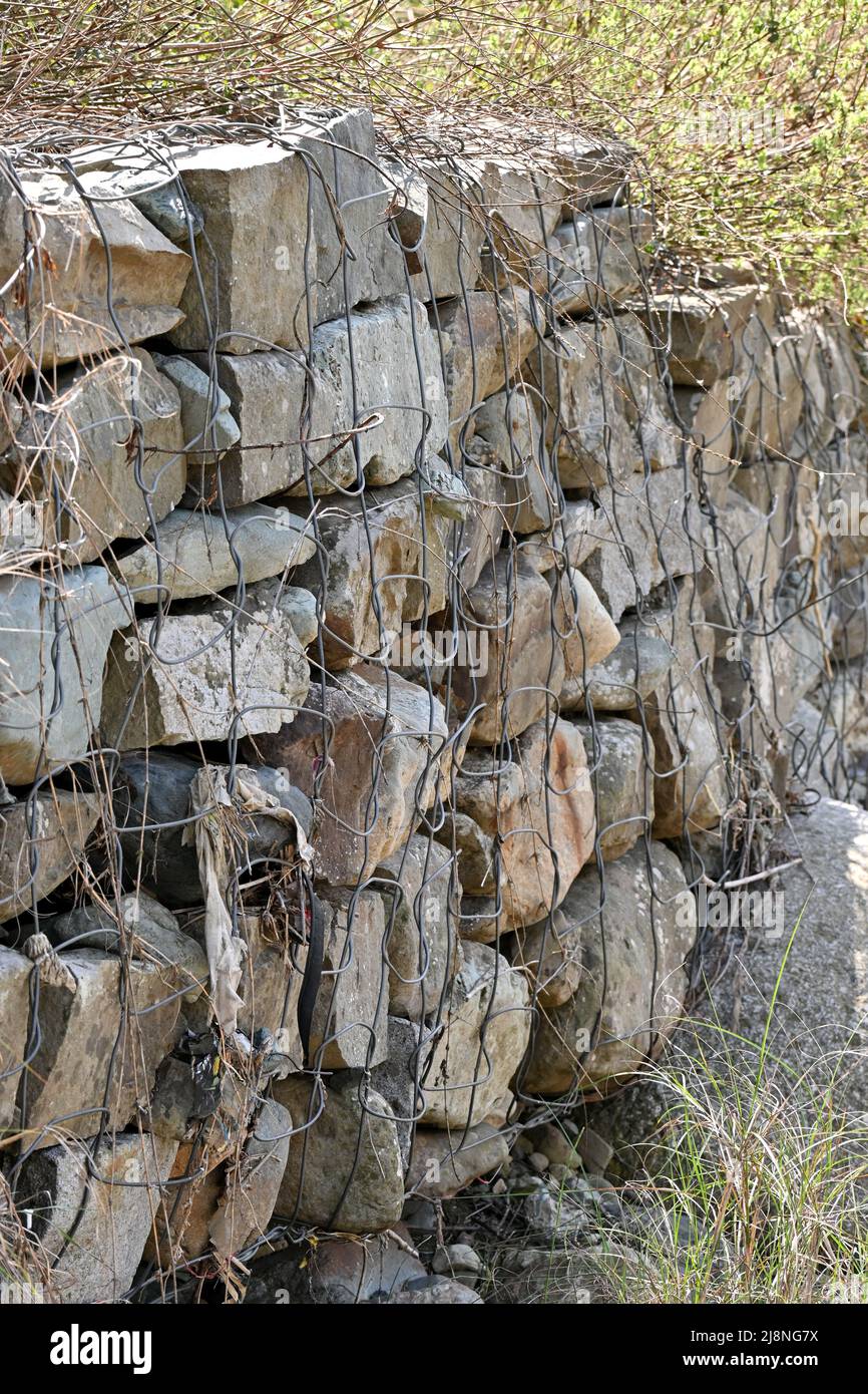 closeup the big bunch grey brown stone tied in the metal wire soft ...