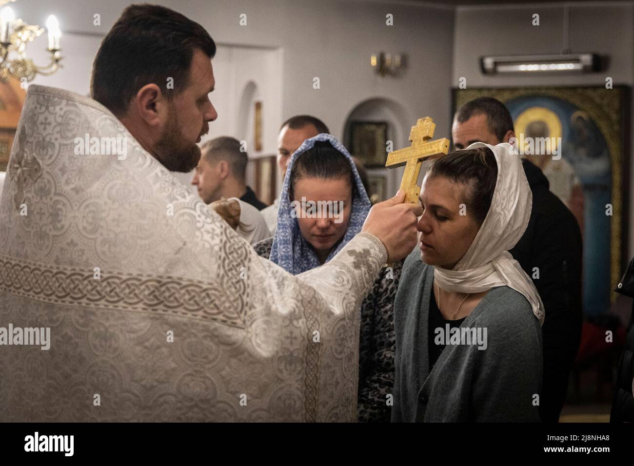 Kharkiv, Ukraine. 01st May, 2022. A priest blesses the congregation ...