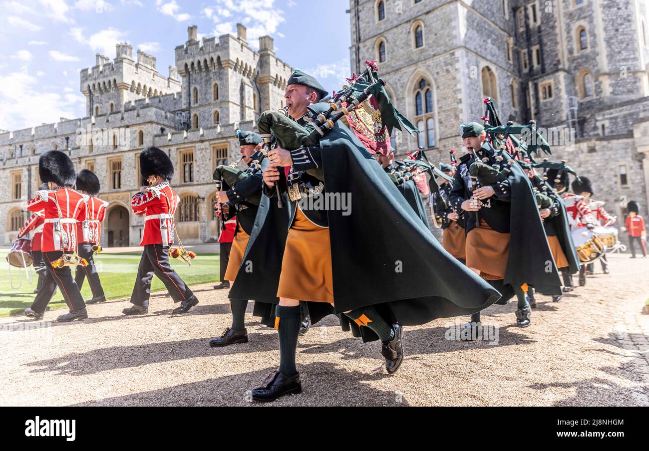 Pipers of the 1st battalion Irish guards march into the Quadrangle of Windsor Castle where new ...