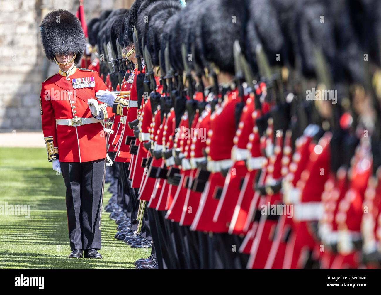 A warrant officer of the 1st battalion Irish guards makes sure the line ...