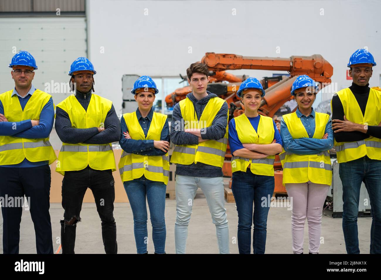 Multi-ethnic group of engineers in group team photo Stock Photo - Alamy