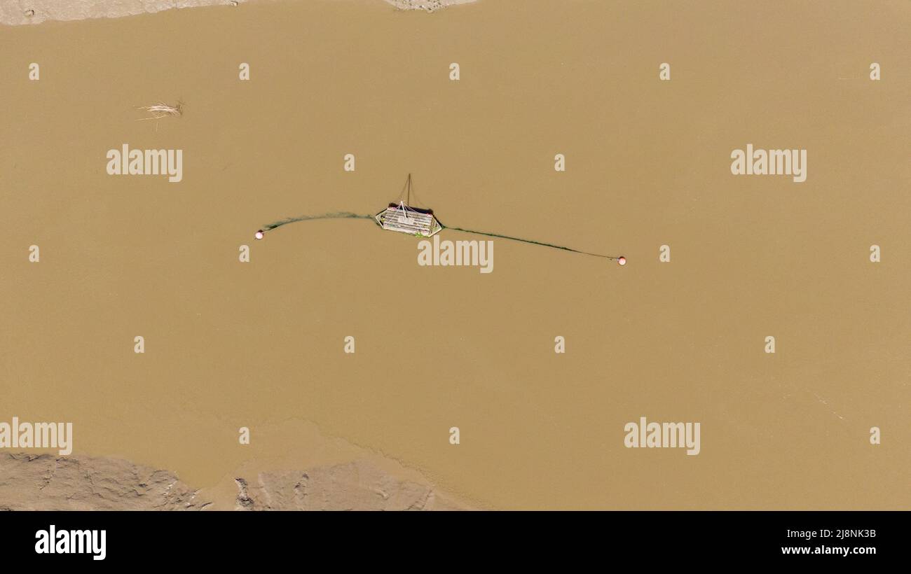 A raft handmade and anchored on the river Stock Photo - Alamy