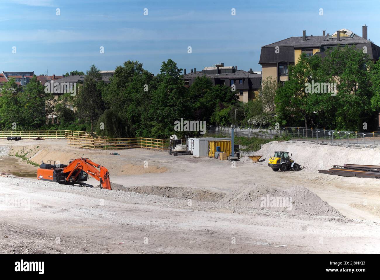 Large construction site, large excavation pit with cranes, excavators ...
