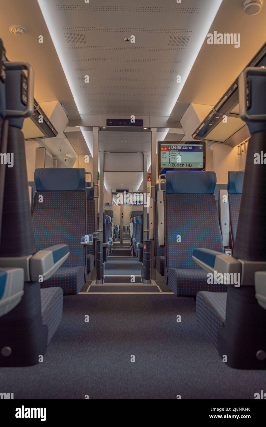 Interior of passenger switzerland train with blue comfortable seat ...