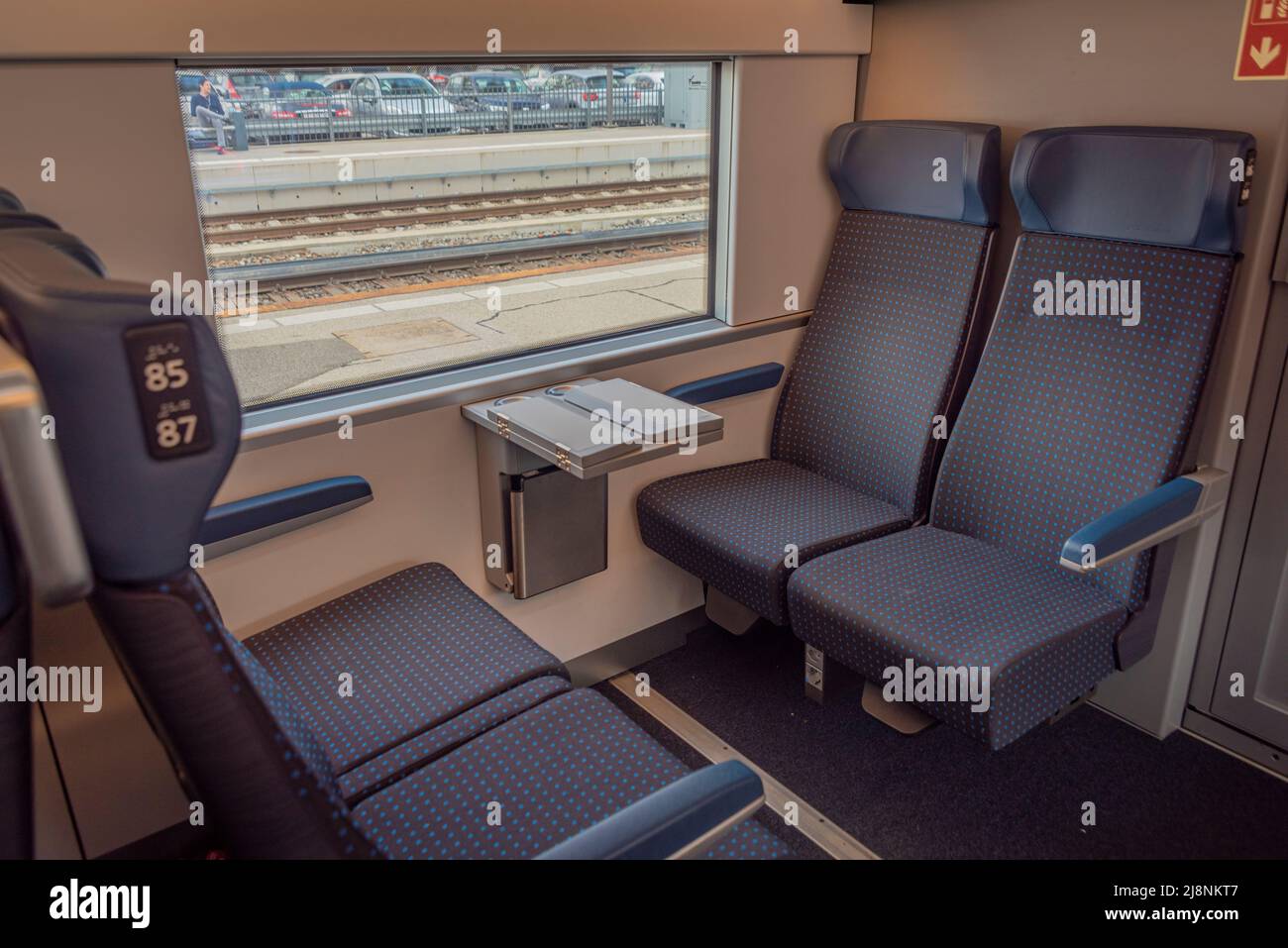 Interior of passenger switzerland train with blue comfortable seat ...