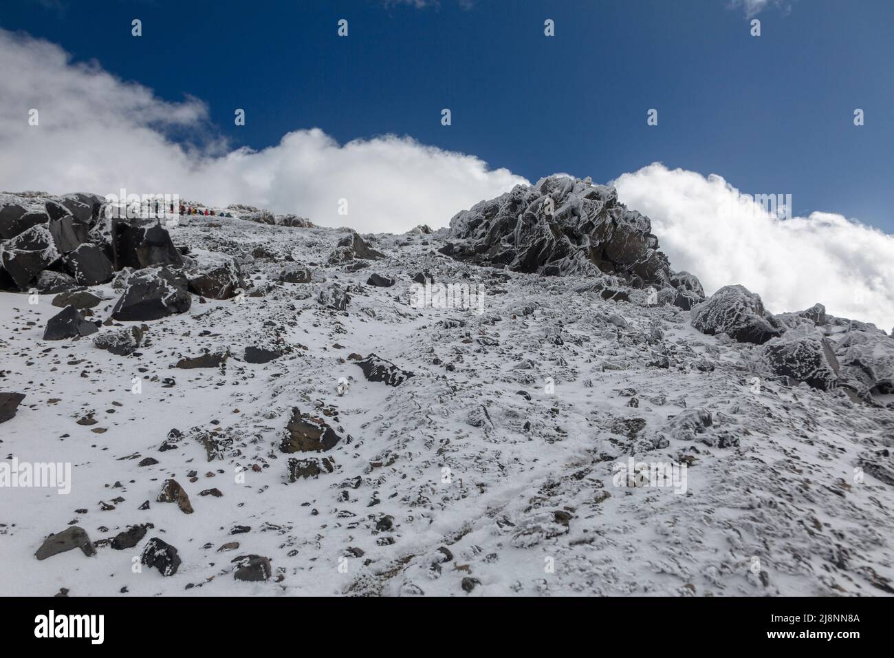 Frozen rocks and stones on the tourist hike path in mountains, Mount ...