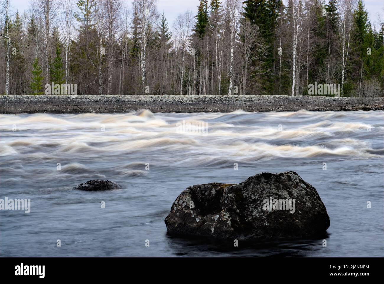 Long exposure of a flowing river Stock Photo - Alamy