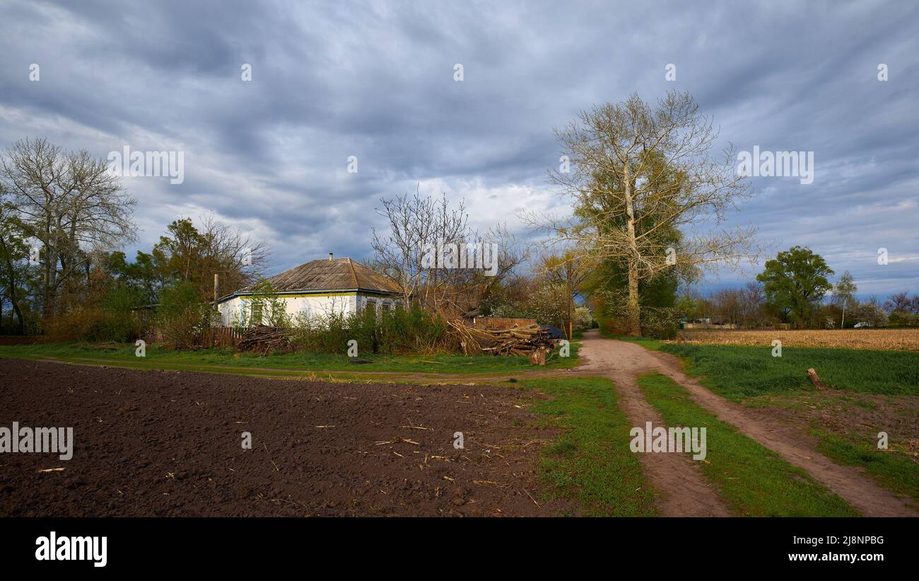Rural scenic landscape, old house by the road in Ukraine Stock Photo ...