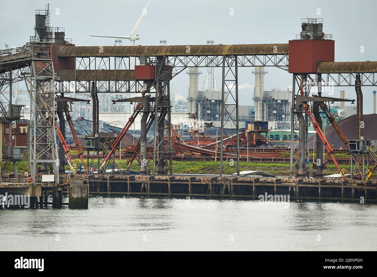 Industrial harbor with rusty structures Stock Photo - Alamy