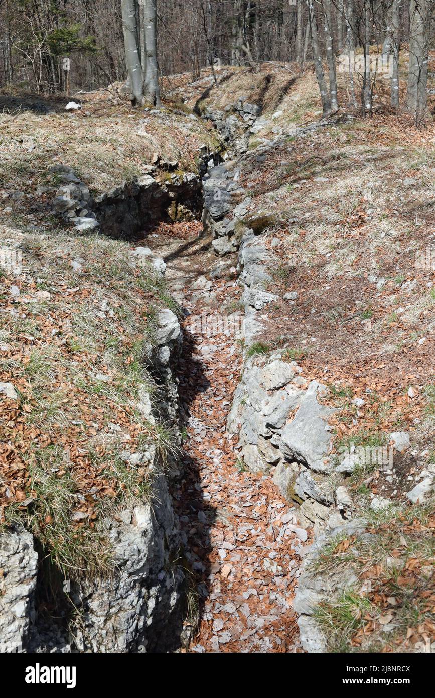long war trench dug into the rock by soldiers to defend against enemy ...