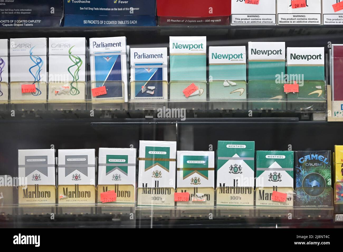 Tobacco cigarettes, including menthols in green packages, displayed for ...