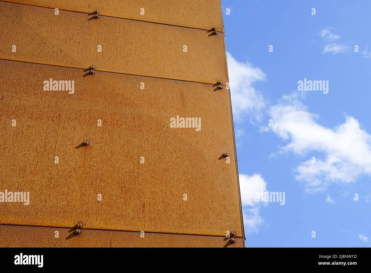 Rusted corten steel panels cladding facade of a modern design house on ...