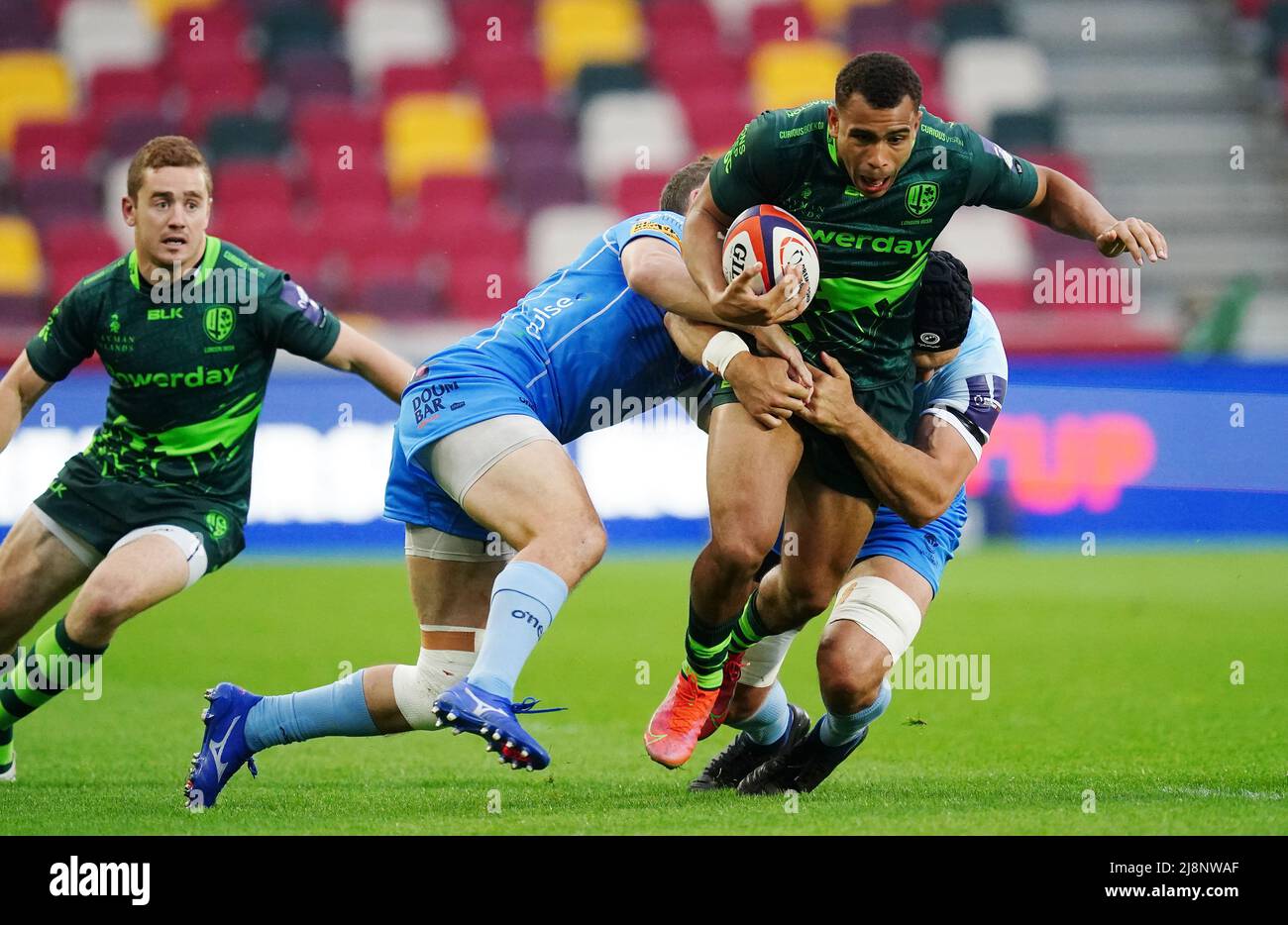 London Irish's Will Joseph of is tackled by Worcester's Ashley Beck ...