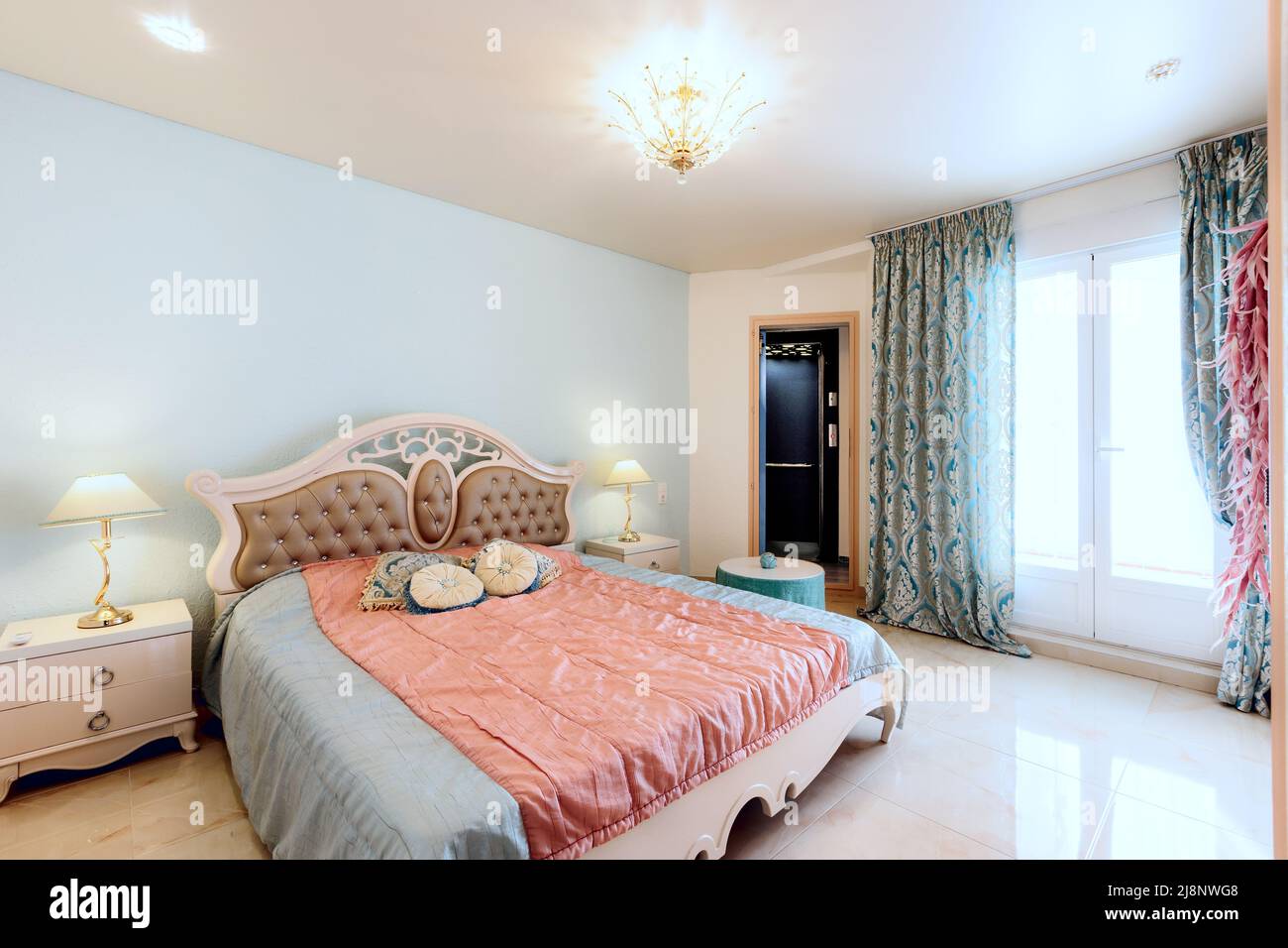 The romantic bedroom in gentle tones with classical furniture and cozy ...