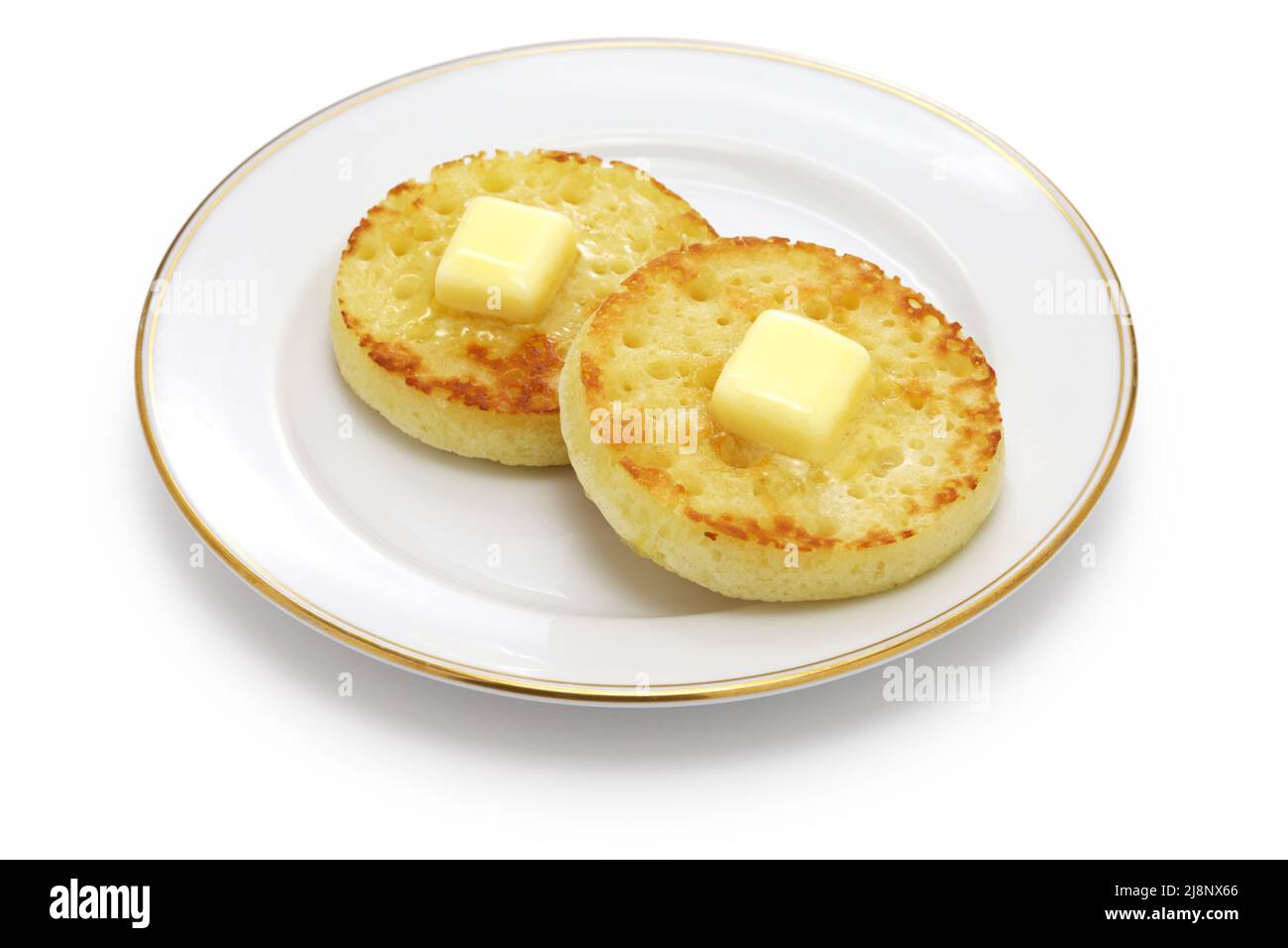 toasted homemade crumpets with butter Stock Photo - Alamy