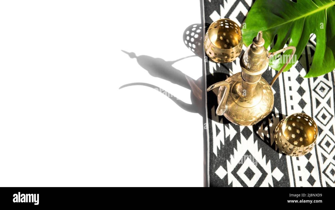 Arabic jug and golden decorations on white background Stock Photo - Alamy