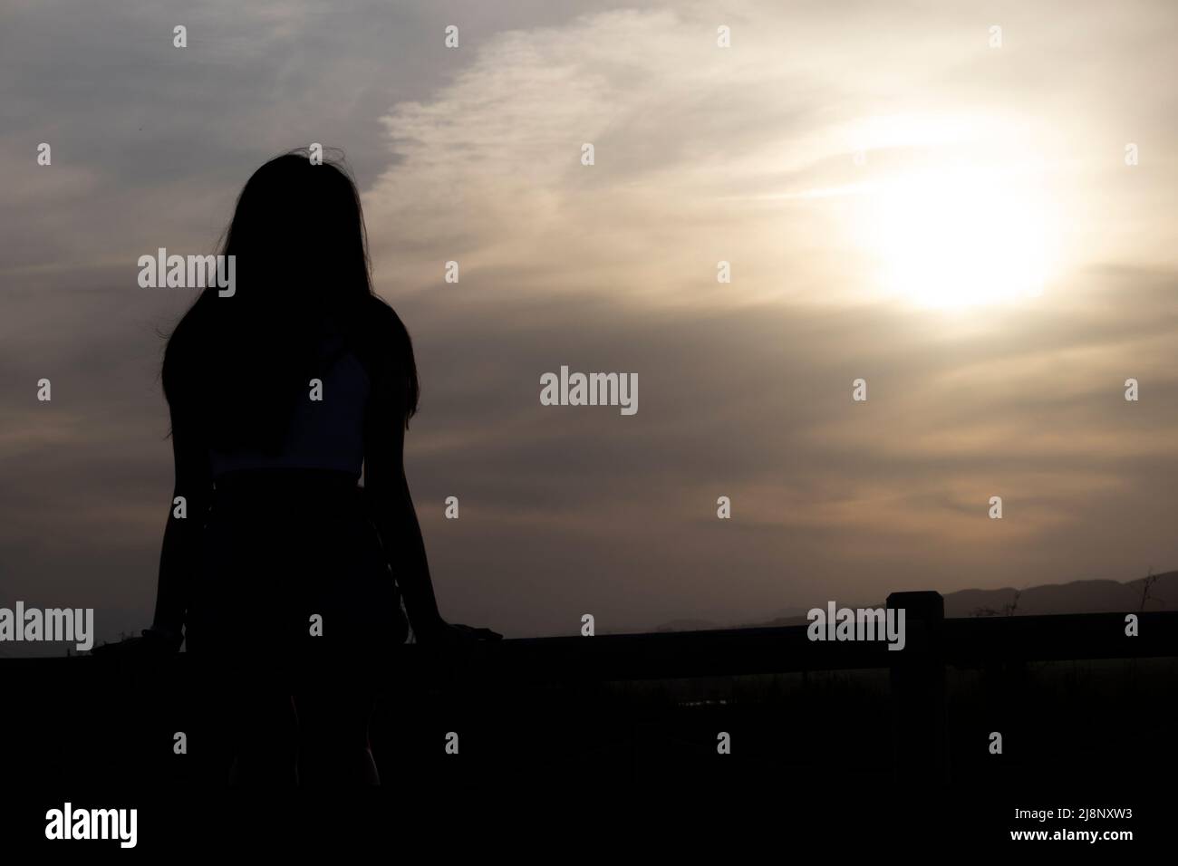 backlight figure of young girl Stock Photo - Alamy