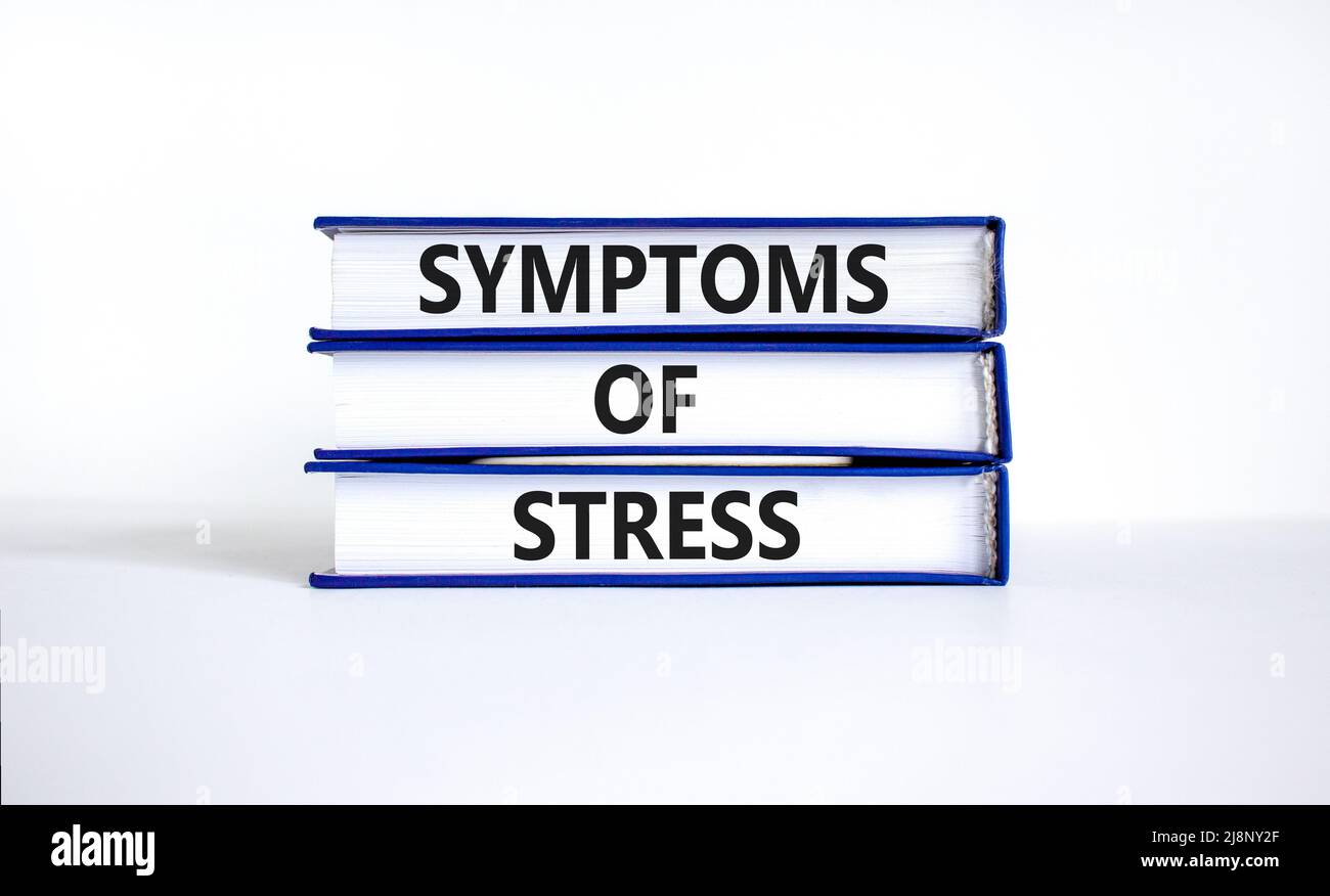 Symptoms of stress symbol. Concept words Symptoms of stress on books ...