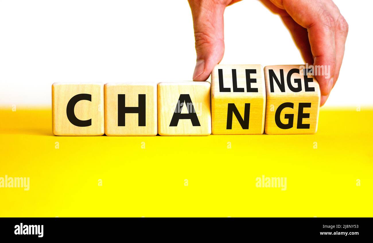 Chance or challenge symbol. Businessman turns wooden cubes and changes ...