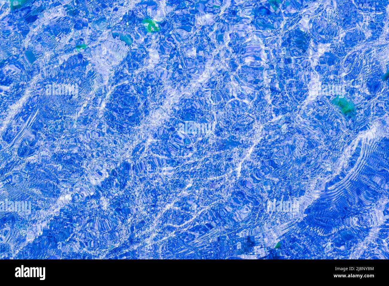 abstract vibrant blue water textured noisy background with copy space ...