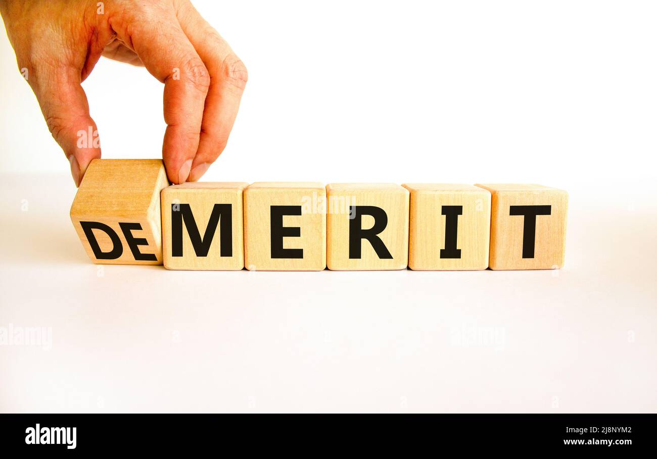 Demerit or merit symbol. Businessman turns wooden cubes and changes the ...