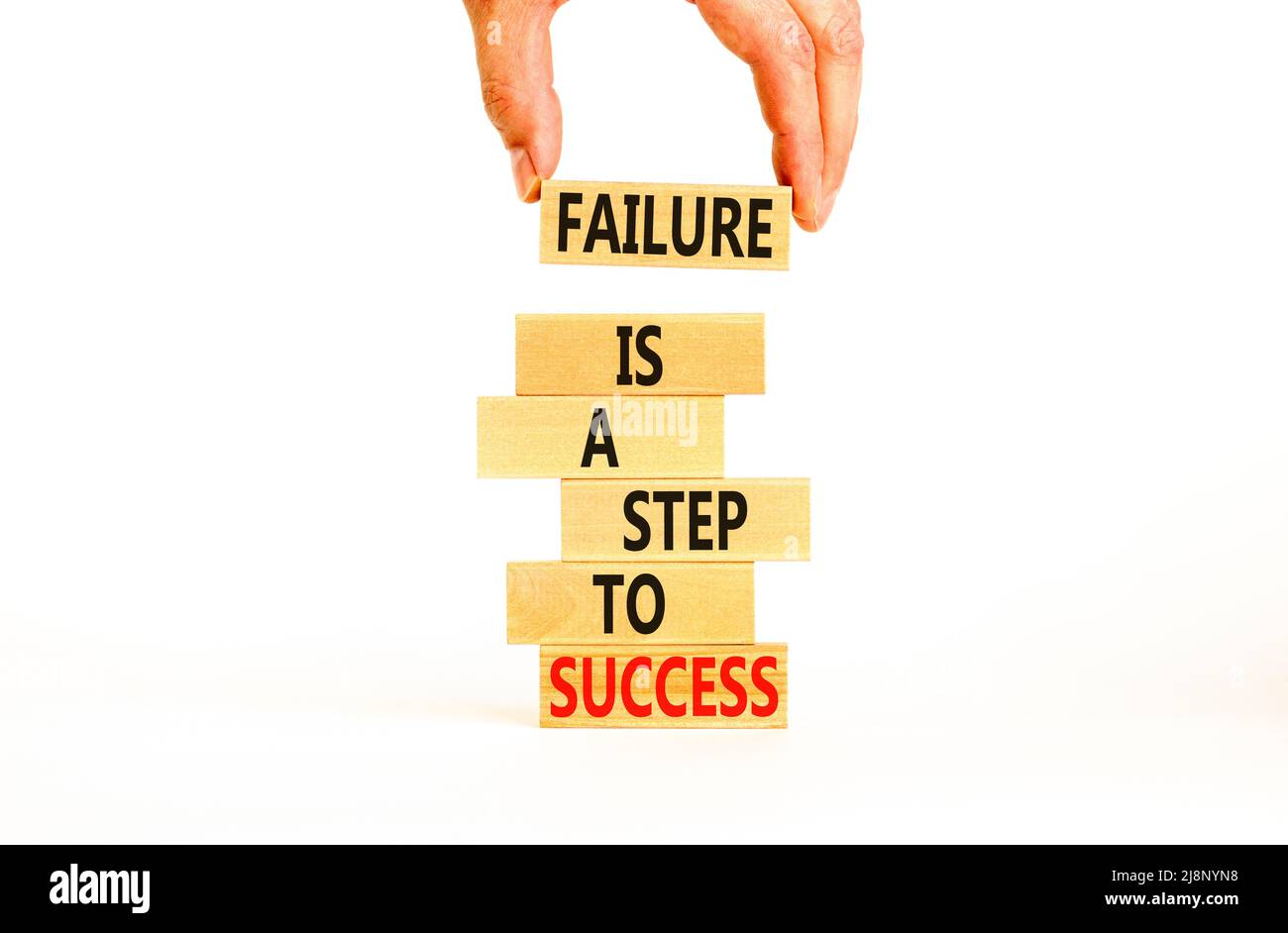 Failure or success symbol. Wooden blocks with words A failure is a step ...