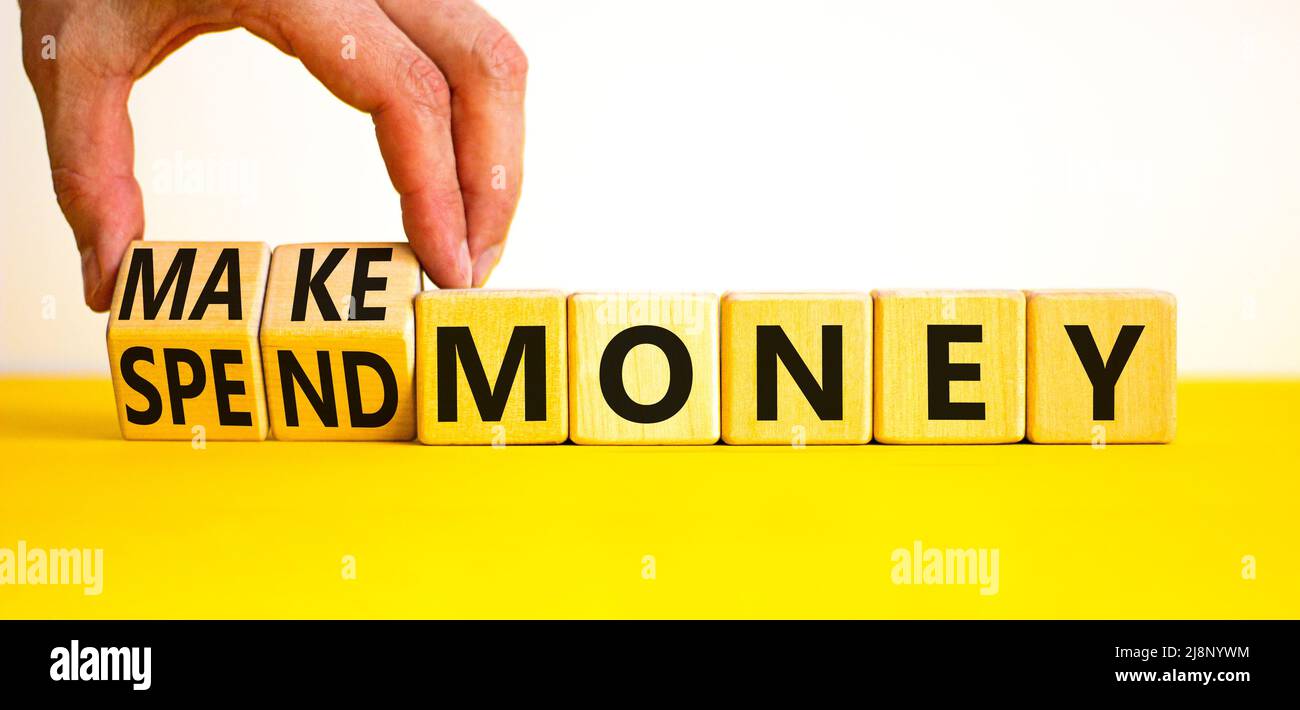 Spend or make money symbol. Businessman turns cubes and changes concept ...