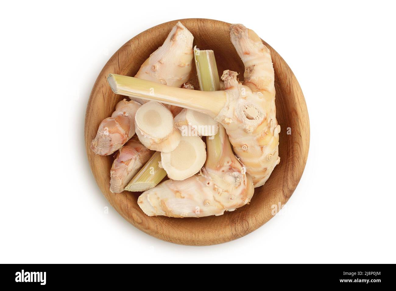 Fresh galangal root in wooden bowl isolated on white background with ...