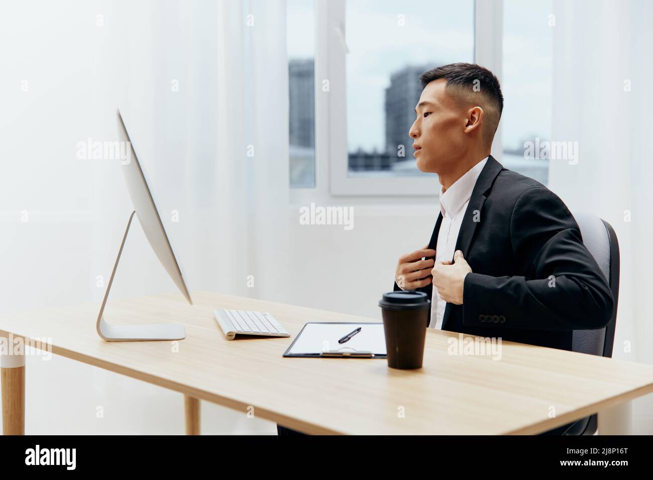 manager sitting at a desk in front of a computer emotions Workspace ...