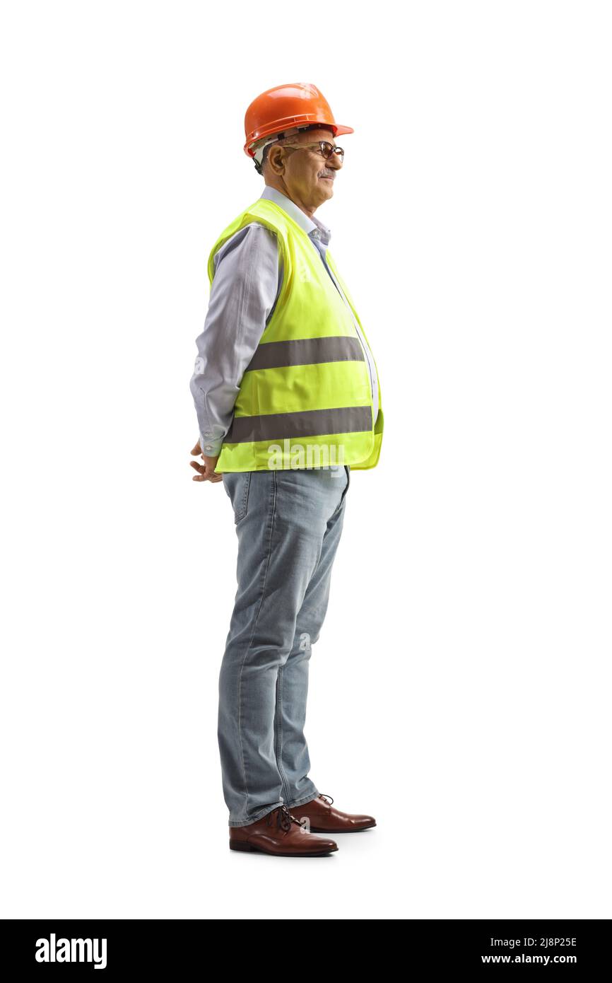 Full length profile shot of a mature male engineer with a safety vest ...