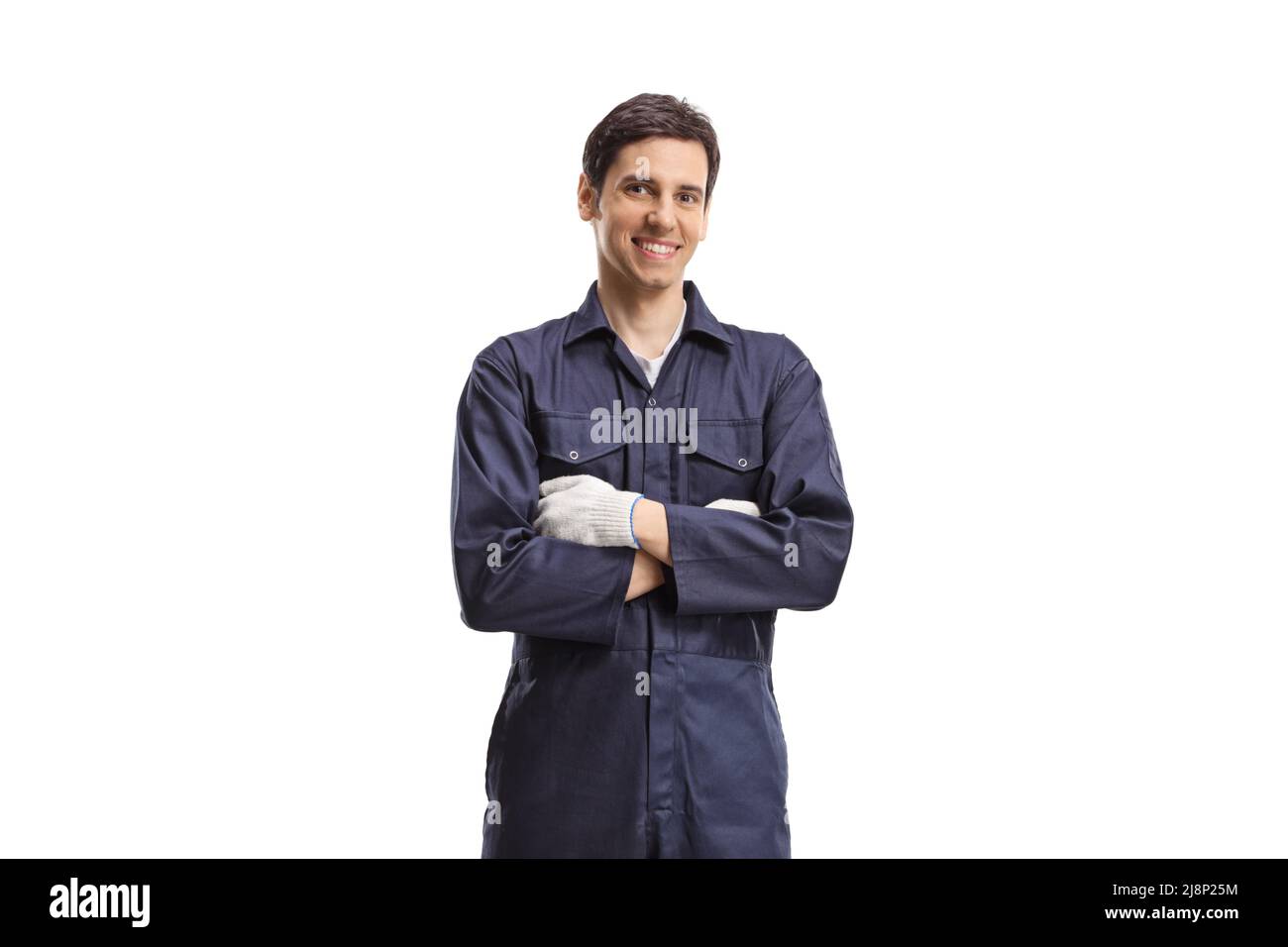 Smiling male worker in a uniform posing with crossed arms isolated on ...