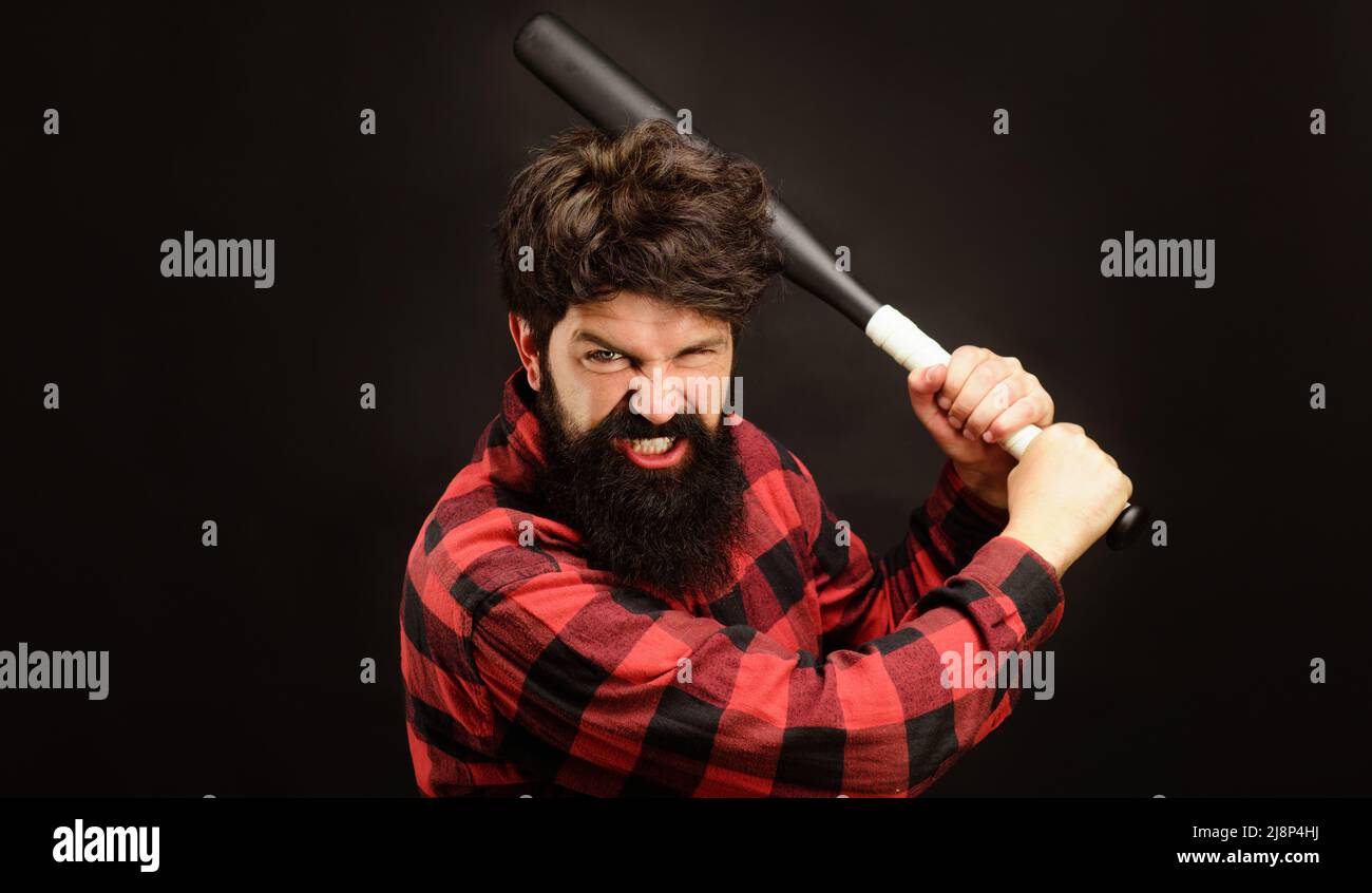 Angry bearded man in plaid shirt swing baseball bat. Sport equipment ...