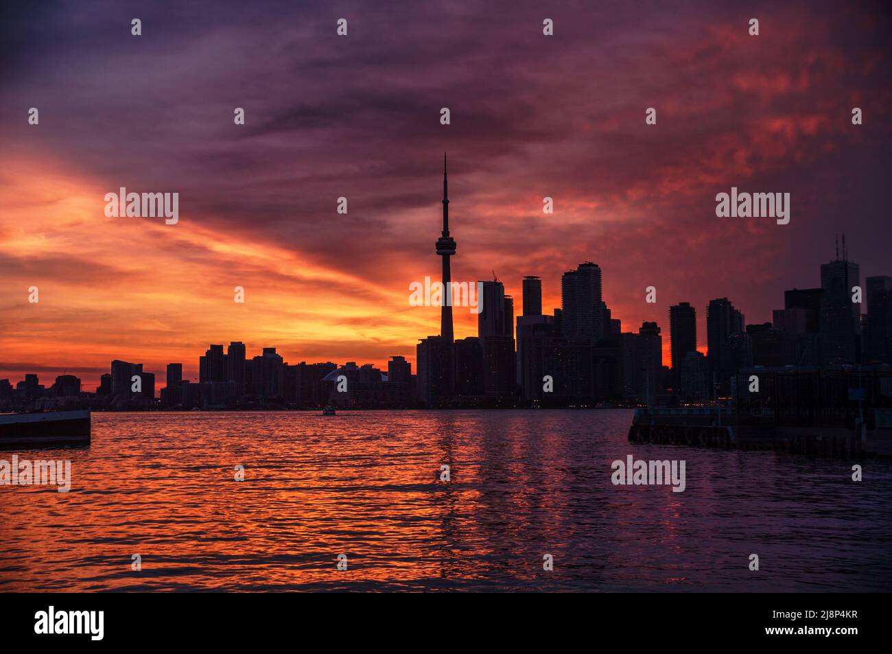 Summer sunset view from Toronto Islands across the Inner Harbour of the ...
