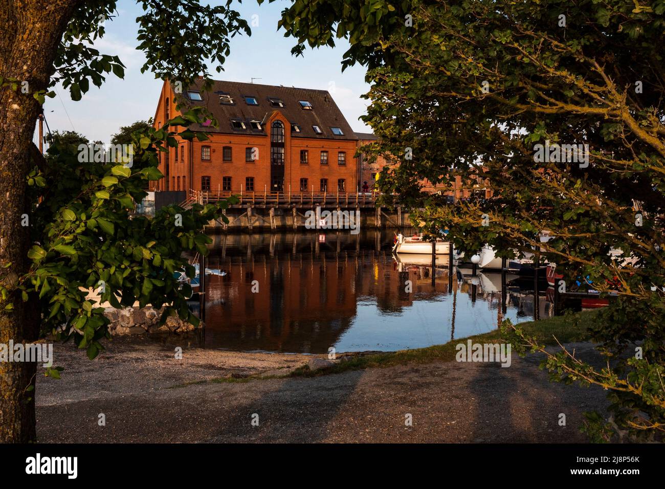 Evening atmosphere in the harbour Orth, island Fehmarn, Germany Stock ...