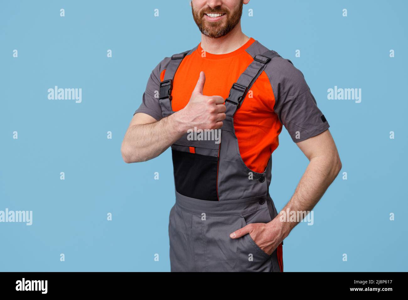 Unrecognizable smiling worker man In uniform showing thumbs up Stock ...
