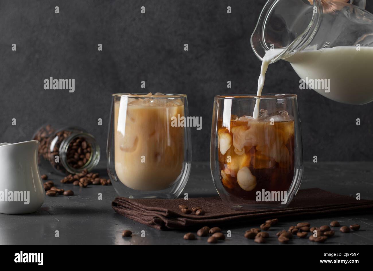 Espresso being poured two glasses hi-res stock photography and images ...
